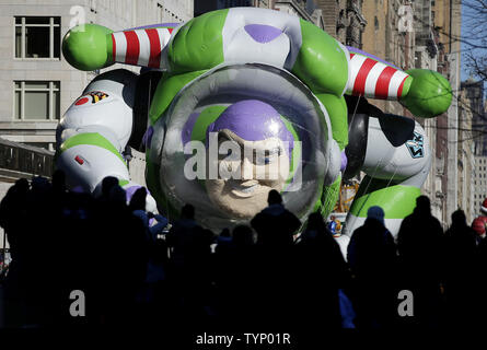 The Buzz Lightyear balloon floats down Sixth Avenue during the Macy's ...