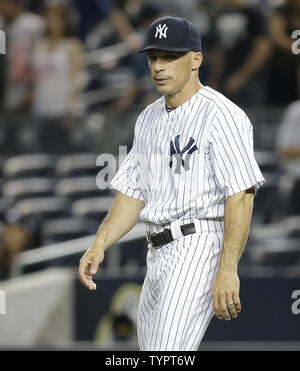New York Yankees' Joe Girardi, left, talks to home plate umpire Mike ...