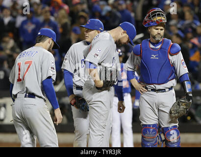 Chicago Cubs' David Ross stands in the dugout during a baseball game ...