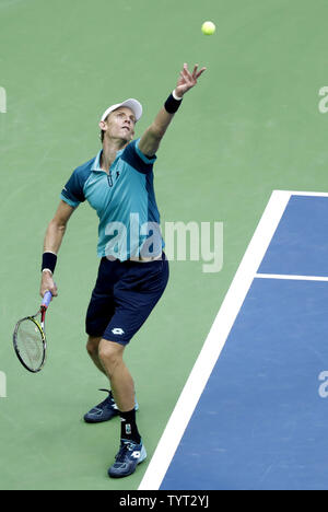 Kevin Anderson, of South Africa, serves to Jenson Brooksby during a ...