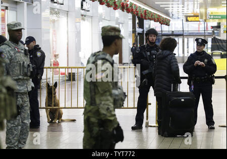NYPD Counter-Terrorism Unit Officers stands guard inside New York Penn ...