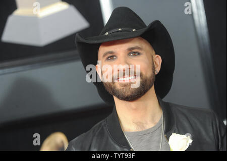 Joe Saylor arrives at the 60th Annual GRAMMY Awards red carpet at ...
