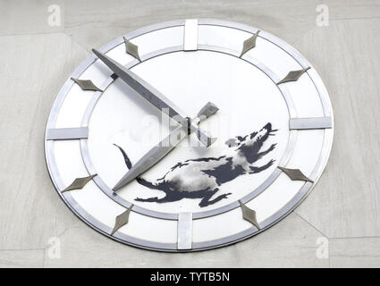 A painting of a rat running in a street clock face like a hamster wheel ...
