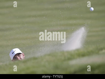 Brooks Koepka hits from the bunker on the first hole during the first ...