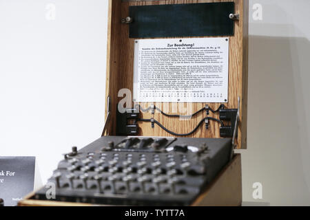 An Enigma machine rotor on display showing the internal wiring in ...