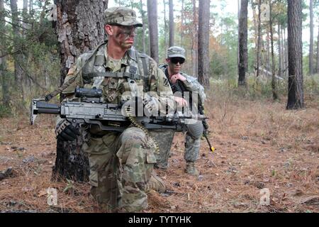 Spc. Brett Bitner (front) an infantryman with Bravo Company, 1st ...