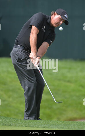 Phil Mickelson chips onto a green during the second round of the St ...