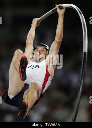 American pole vaulter Toby Stevenson doffs his helmet to celebrate ...