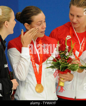 Gold medal winner Margaret Hoelzer of the U.S., center, silver medal ...
