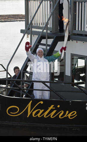 Torch bearer Mike Marcoux from Surrey runs the New Westminster Quay and ...