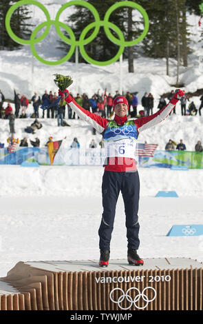 The USA's Bill Demong celebrates winning gold after crossing the finish ...