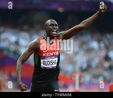 Kenya's David Lekuta Rudisha raises his arms in jubilation as he wins ...
