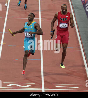 Bahama's Ramon Miller (L) celebrates his team's victory in the Men's ...