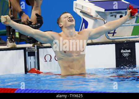 Great Britain's Adam Peaty with his gold medal on the podium after ...