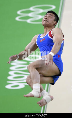 North Korea's Ri Se Gwang stands with his national flag after winning ...