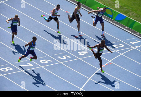 Damian Warner, of Canada, wins a heat in the men's decathlon 110-meter ...
