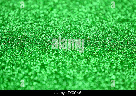 A huge amount of green decorative sequins. Background image with shiny ...