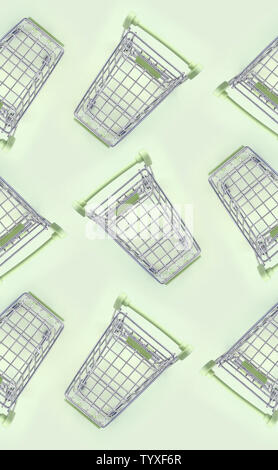 Pattern of many small shopping carts on a lime background. Minimalism ...