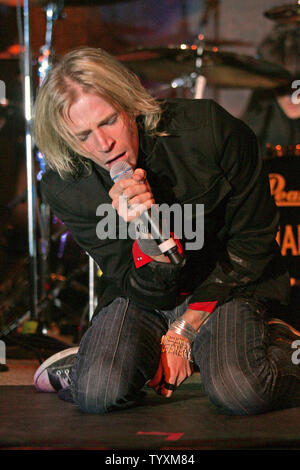 Marty Casey, lead singer for the rock group Lovehammers, performs in ...