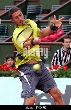 Russian Marat Safin hits a forehand during his match with Jean-Rene ...
