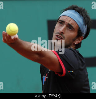 Italian Potito Starace prepares to serve during his French Open mens ...