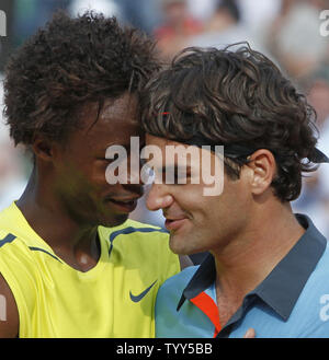 Frenchman Gael Monfils (L) congratulates Roger Federer of Switzerland ...