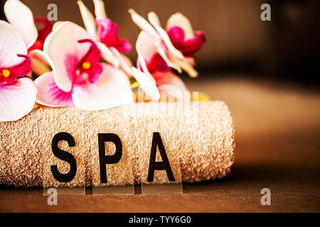 Chocolate Spa . Composition brown towel in hotel room of spa treatment ...