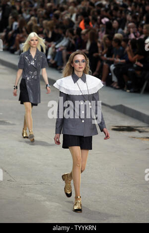 Models take to the catwalk during the presentation of Chanel's 2015 ...