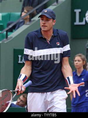 John Isner reacts to a shot against Nicolas Almagro during the Sony ...