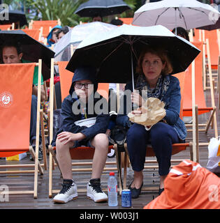 Fans wait for play to resume during the World Cup Group I soccer match ...