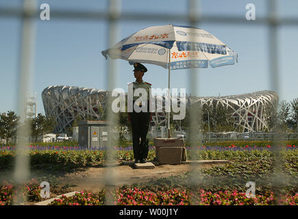 Chinese paramilitary police guard the National Stadium, also known as ...