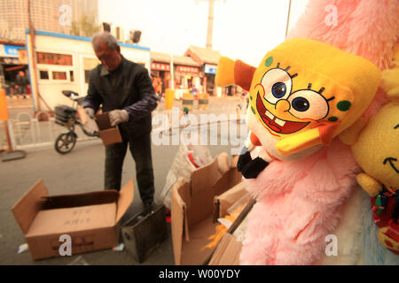 A small SpongeBob SquarePants doll is sold at a market in central ...