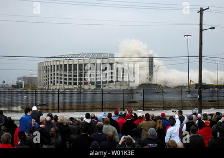 Veterans Stadium comes tumbling down in a series of explosions as a ...