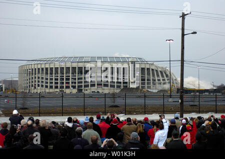 Veterans Stadium comes tumbling down in a series of explosions as a ...