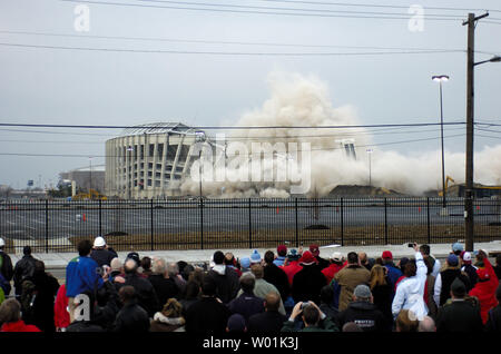 Veterans Stadium comes tumbling down in a series of explosions as a ...