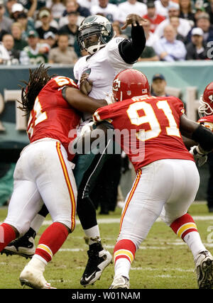 Philadelphia Eagles' Michael Vick, left in headband, speaks after ...