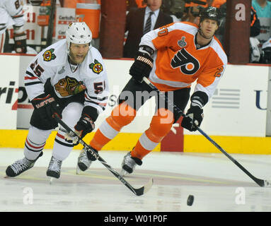 Chicago Blackhawks left wing Ben Eager celebrates in the locker room ...