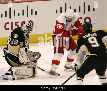 Detroit Red Wings goalie Thomas Greiss, left, stops a shot by Columbus ...