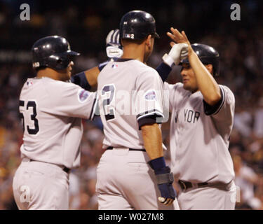 New York Yankees' Bobby Abreu slides safely into second base for a ...