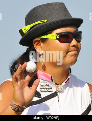 Christina Kim waves to the crowd after finishing her round at the ...