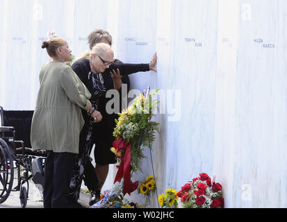 Family and friend of the victims of Flight 93 touches the name of First ...