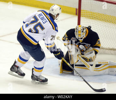 St. Louis Blues goalie Ryan Miller (39) sweeps away the puck during the ...