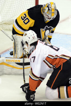 Anaheim Ducks center Rickard Rakell, back, hits Vancouver Canucks left ...