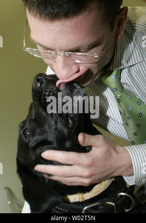 Russian President Vladimir Putin kisses a Alabai puppy gifted him by ...