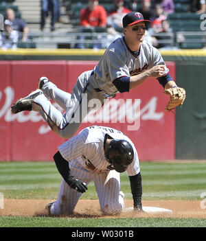 A ball hit by Chicago White Sox's Luis Robert Jr. bounces off the glove ...