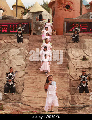 Dwarves sing, dance and act during a twice-daily performance for ...