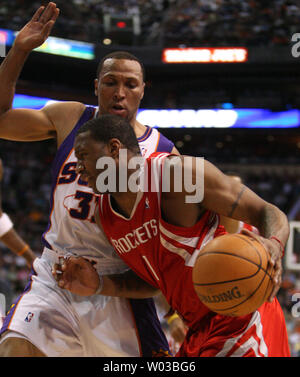 Houston Rockets forward Tracy McGrady looks to pass to the open man ...