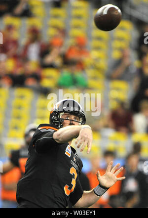 Oklahoma State University quarterback Brandon Weeden warms up before ...