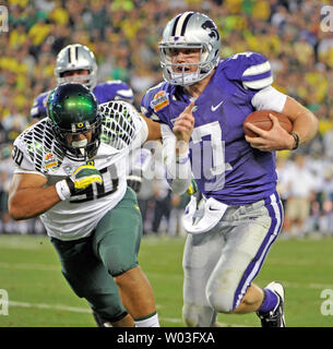 Kansas State quarterback Collin Klein (7) with his wife, Shalin, left ...