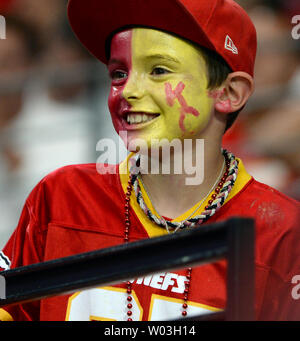A young Kansas City Chiefs fan looks on during an NFL football game ...